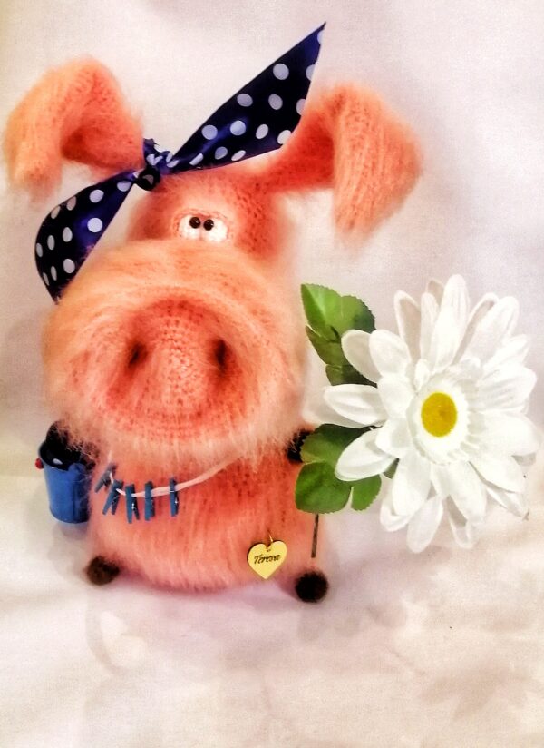 Stuffed pink pig as a gift to a farmer. Cute farm pig.