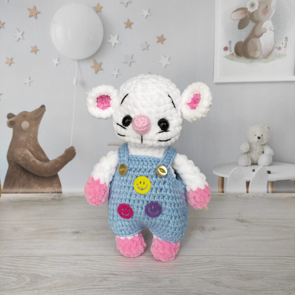 A cute little plush white mouse toy a great surprise for a baby